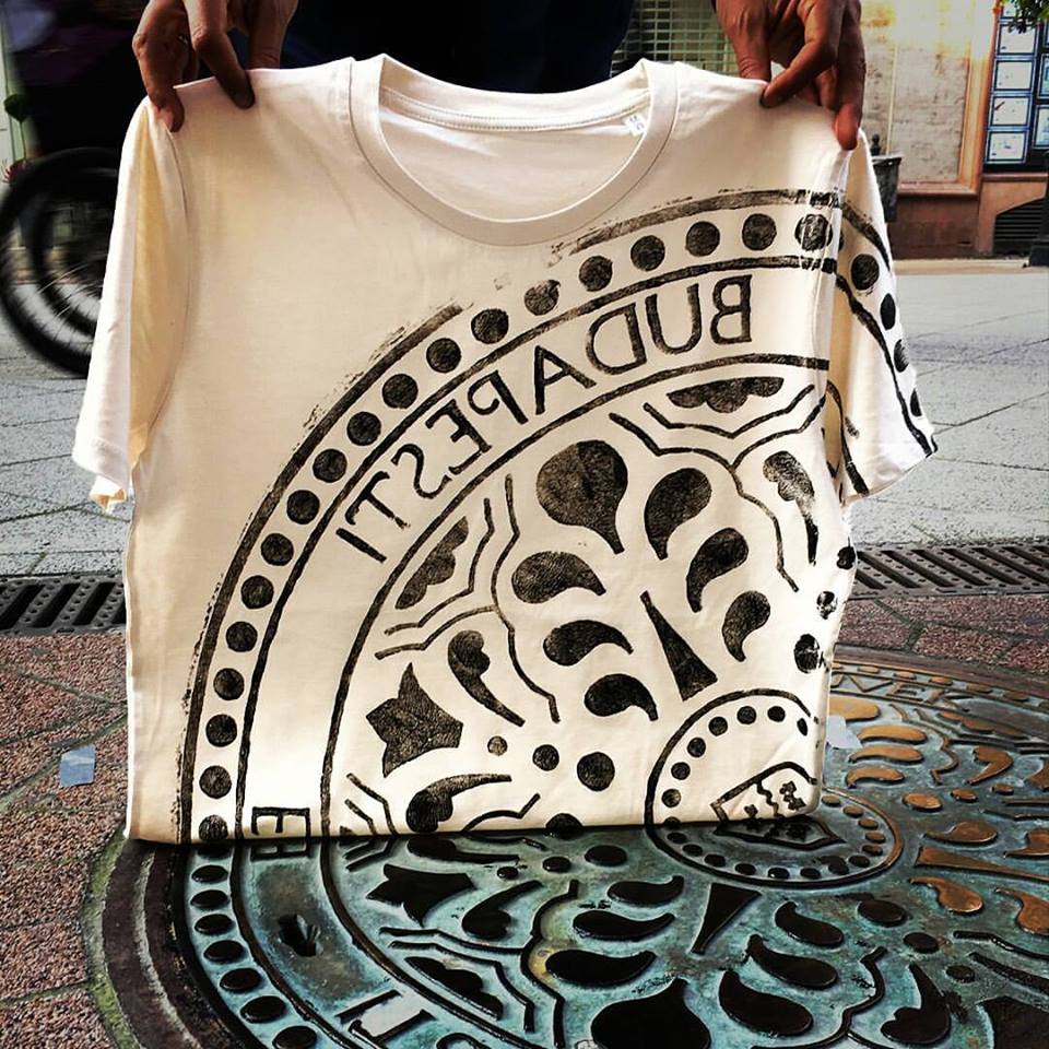 German Art Collective Prints Fashionable Clothes Directly on Manhole Covers