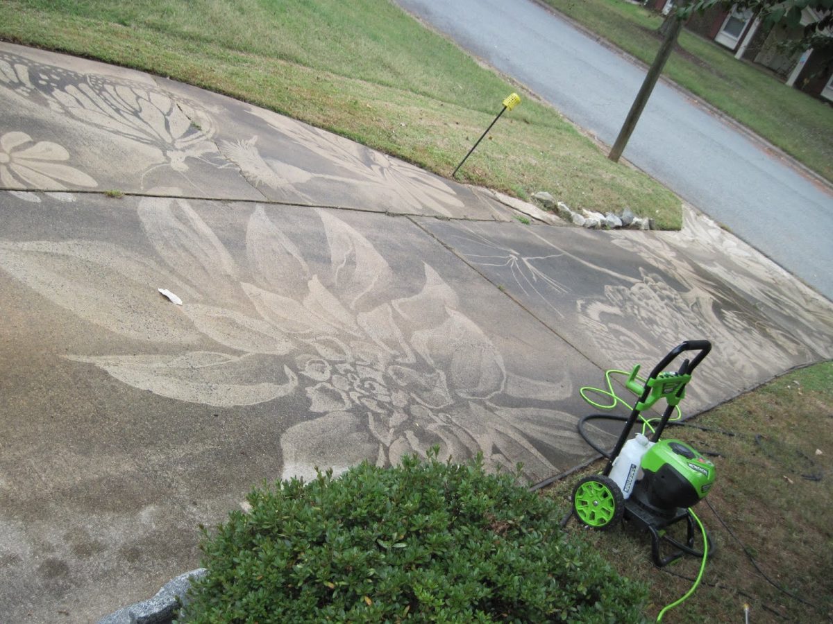 Woman Uses Power Washer to Turn Driveway into Artistic Canvas